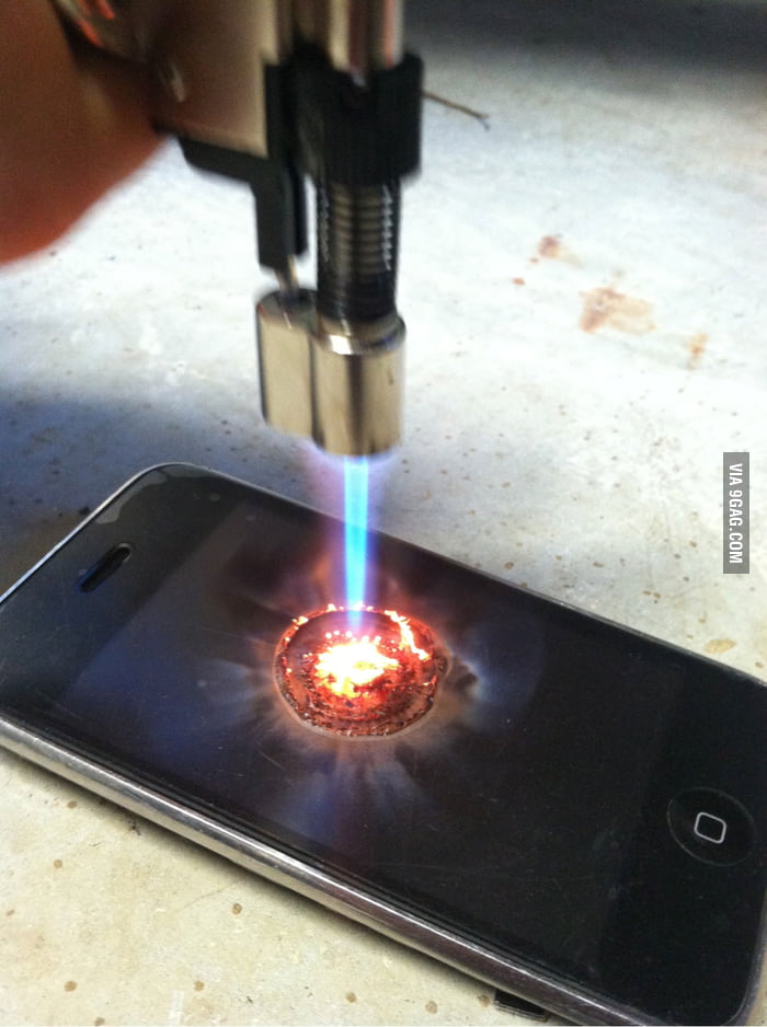 An iPhone being burned with a butane lighter. - 9GAG
