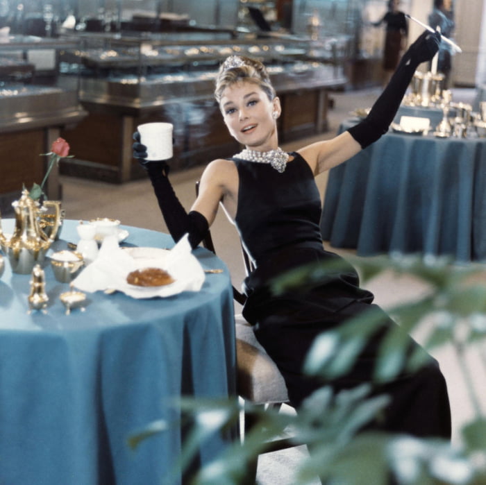 Audrey Hepburn relaxing on the set of Breakfast at Tiffany's (1961) - 9GAG