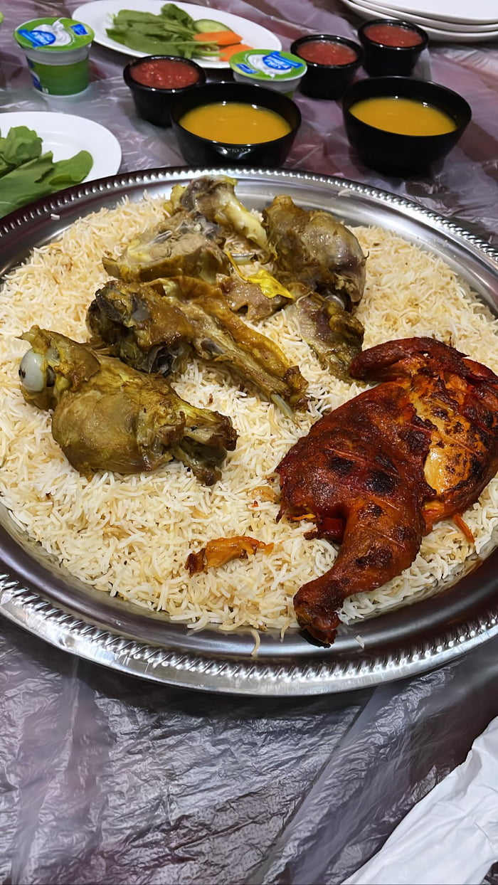 Mandi - a traditional Arabic dish, the meat is cooked in an underground ...