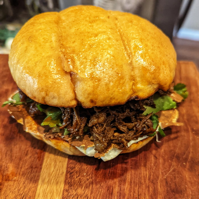 Birria beef torta with fried oaxaca cheese, pickled onions, avacado ...