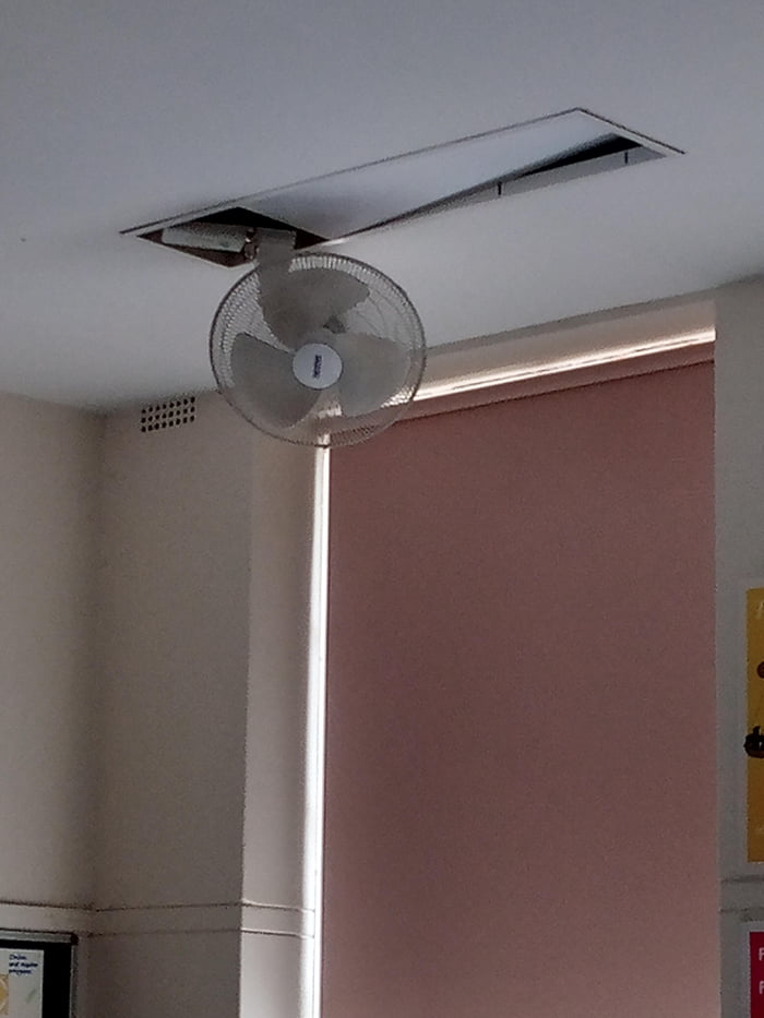 Yes, that is an upside-down desk fan strapped to the ceiling with a ...