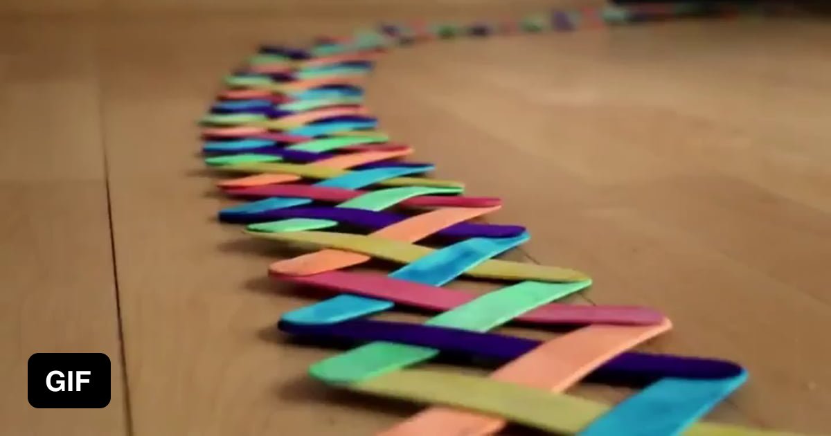 Knocking over a stack of cups using popsicle sticks - 9GAG