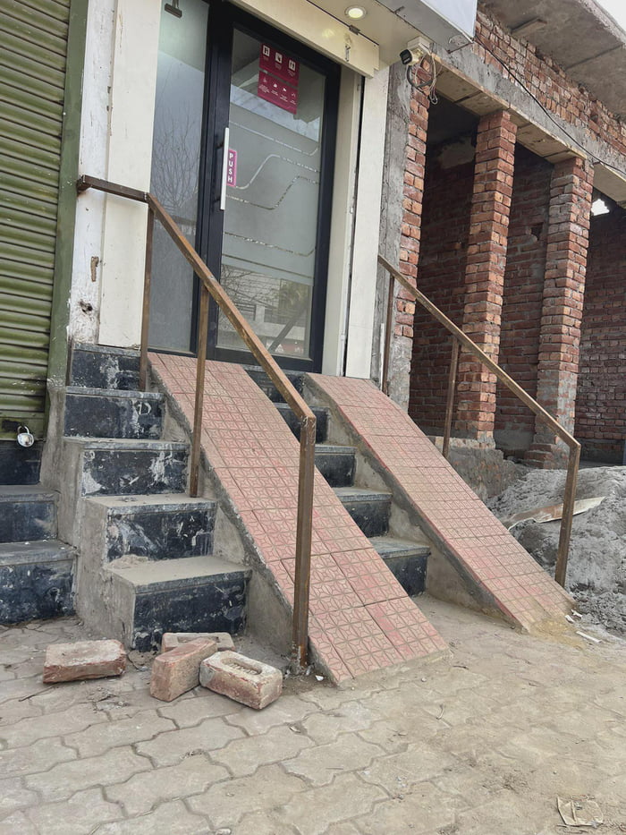 A wheelchair ramp outside a bank ATM - 9GAG