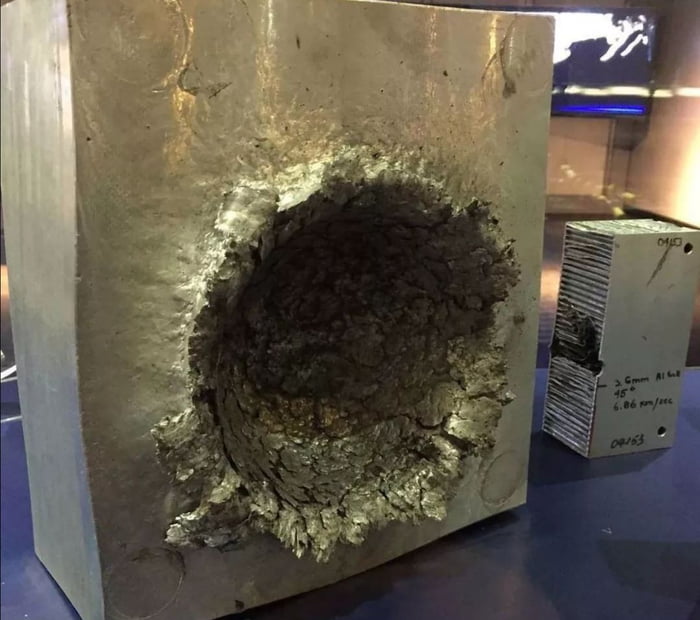 Aluminum block hit by space junk (14 gram piece of plastic) at 28000 km ...