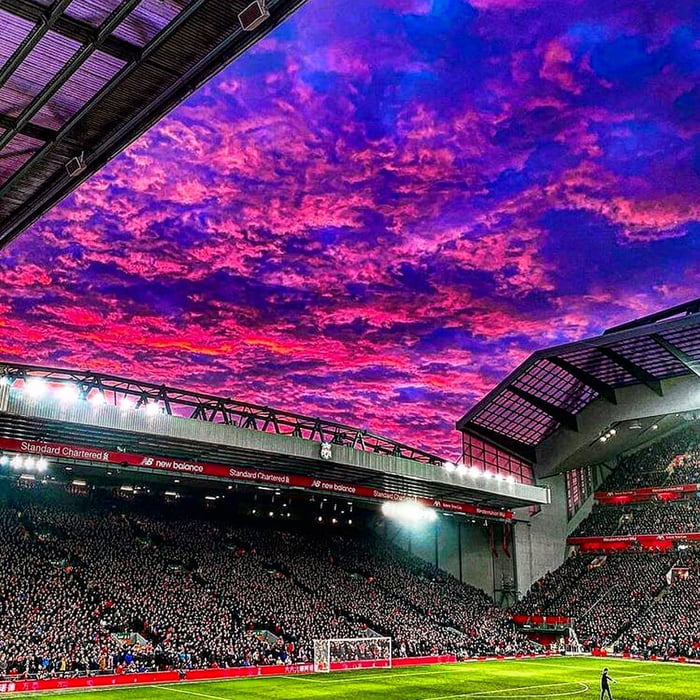 A beautiful night at Anfield. Colors and contrast, a firelit sky! YNWA ...