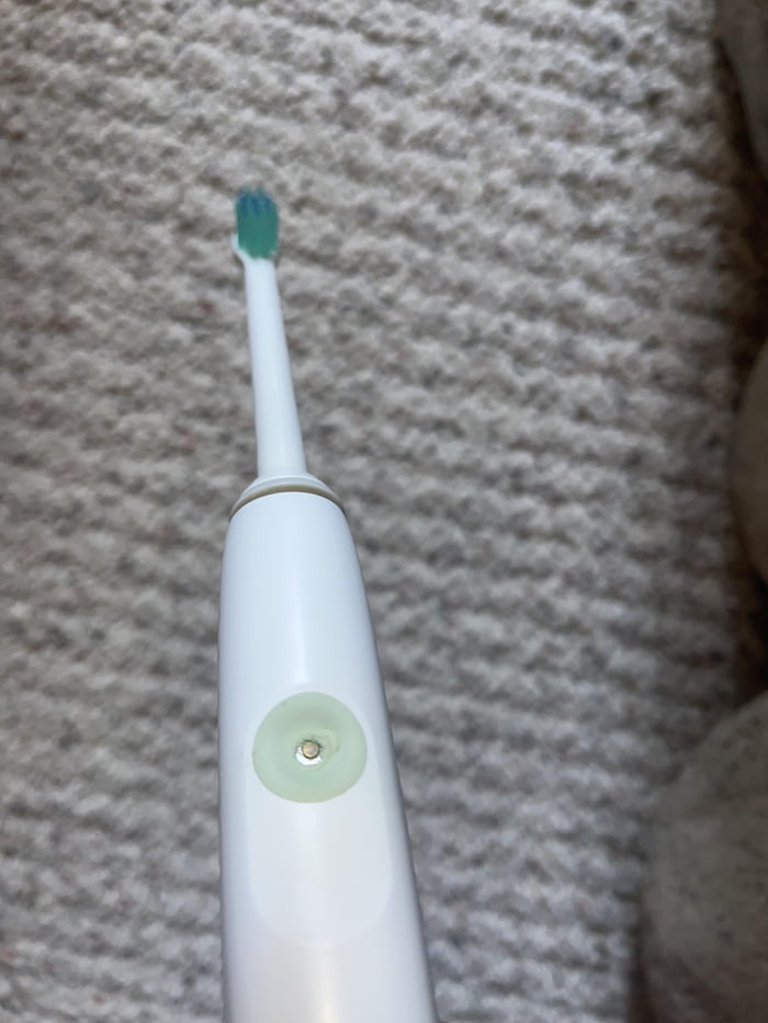 Real size of the button on phillips toothbrush - 9GAG
