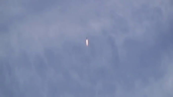 Supersonic shockwaves visible as rocket passes through clouds composed ...