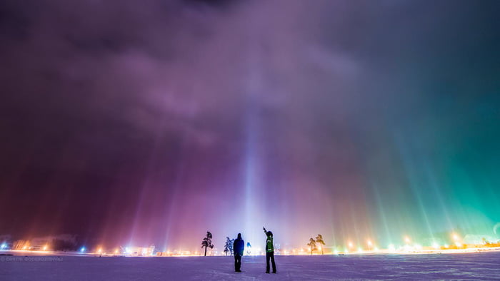 Light reflecting off ice crystals in the air makes pillars of light in ...