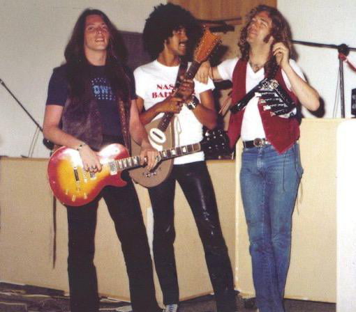 Long-haired Huey Lewis on the far right, with Thin Lizzy members Gary Moore and Phil Lynott ...