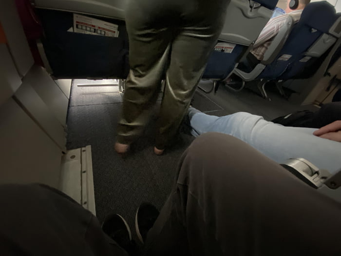 Paid extra for more leg room on a flight, lady decided it was a great place to stand. - 9GAG