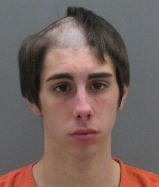 They didn't even let him finish his disguise before taking the mugshot ...