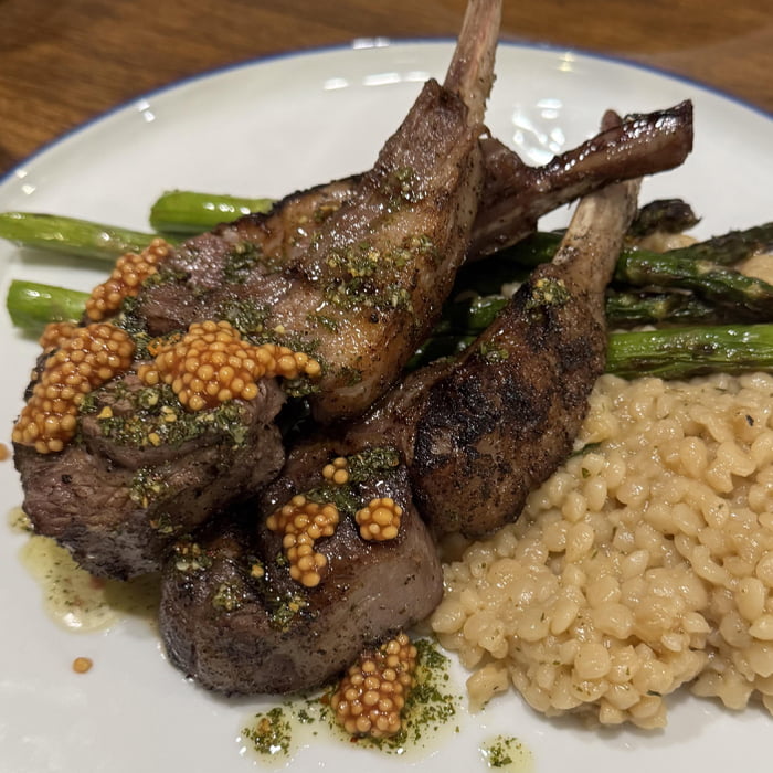 Sous vide rack of lamb seared to finished. Topped with mustard seeds ...