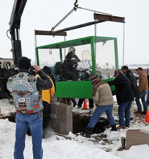 A man’s dying wish was to be buried on his Harley Davidson in a glass ...
