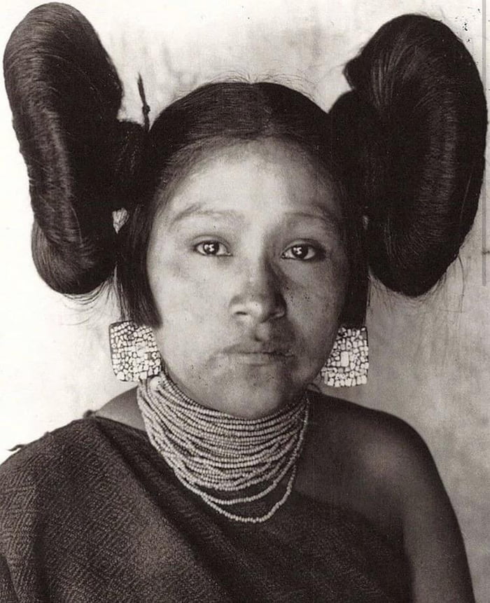 A woman of the Hopi Native American tribe with a squash blossom whorl ...