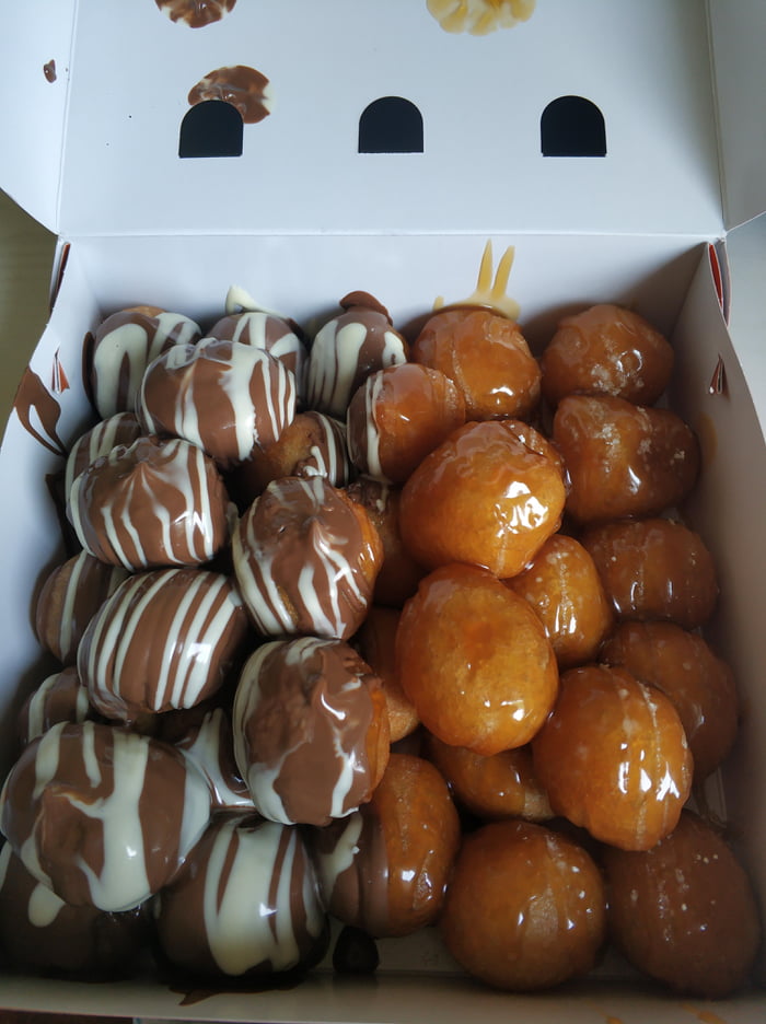 A box of Mr Puffs (pastries with chocolate and caramel sauce) - 9GAG