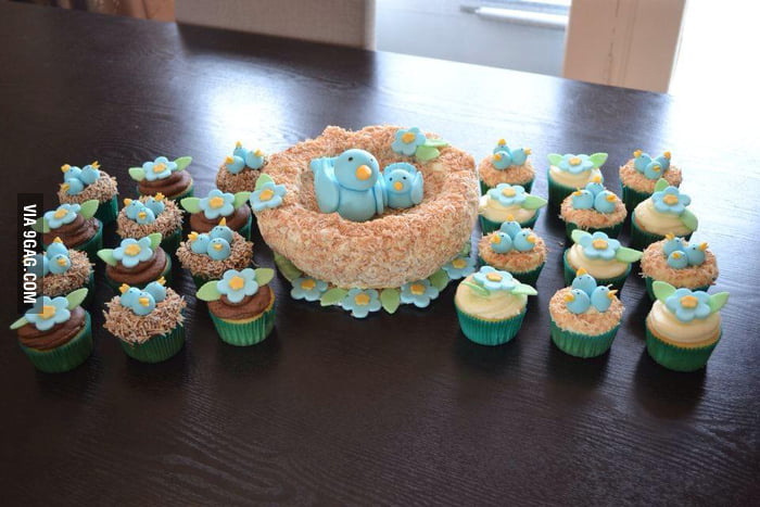Blue bird mamma and baby bird in a coconut cake nest, chocolate and ...