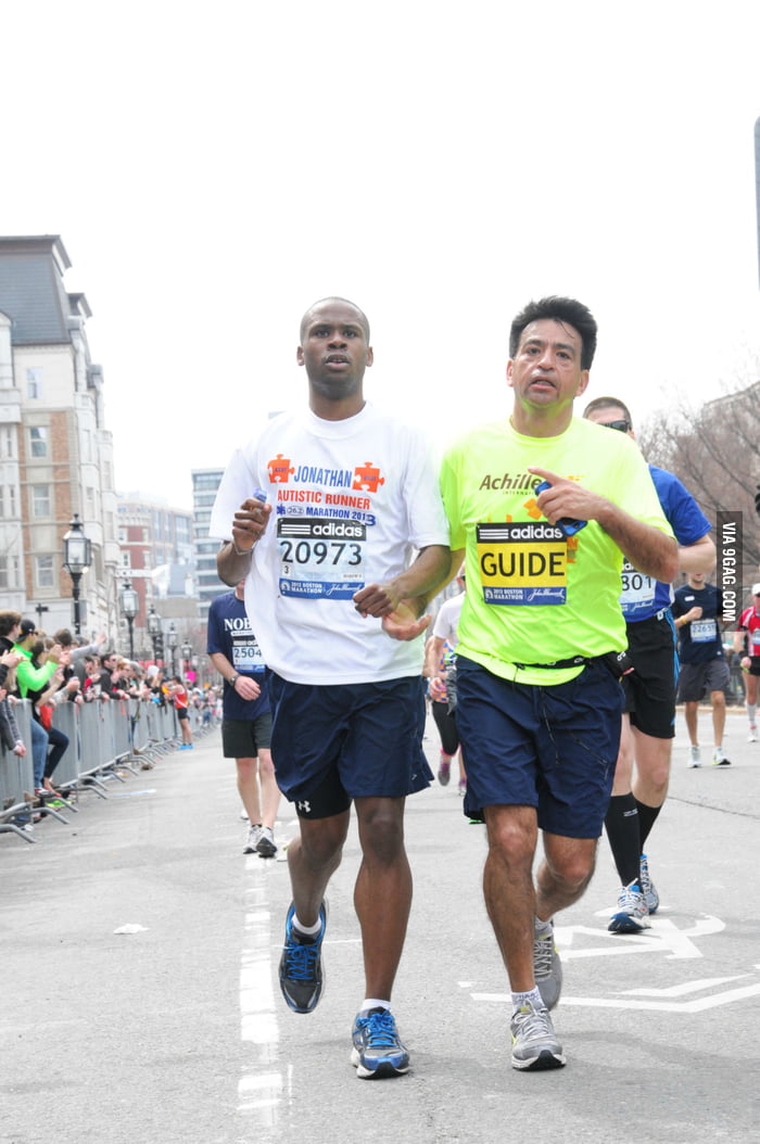 Beautiful photo of a running coach guiding a 26 year old with severe ...