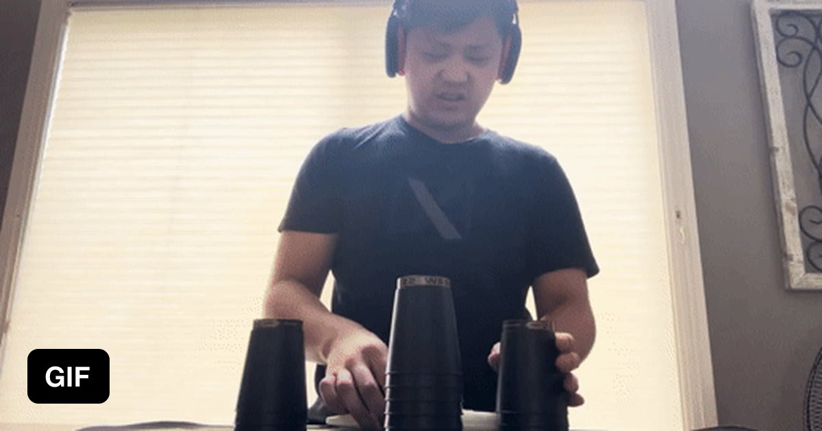 Stacking cups really fast - 9GAG