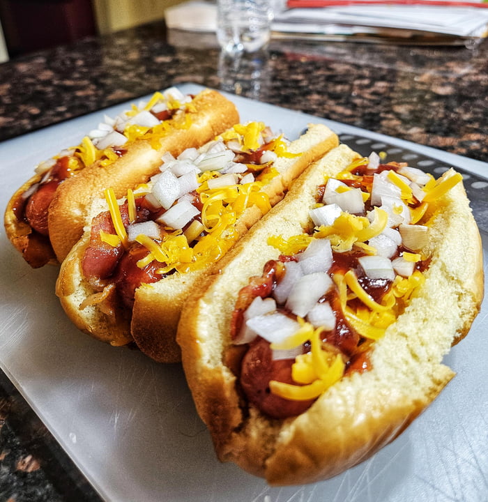 BBQ bacon dogs. Pan-fried dogs in bacon fat. Chopped onion, cheddar ...