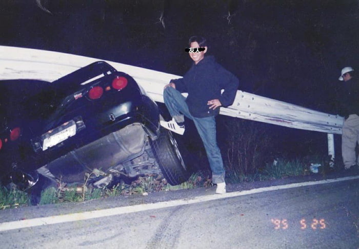 Iconic picture of Japanese teen posing in front of his crashed Skyline ...