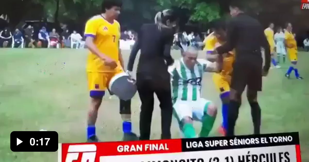 Opponents show respect and help an injured player during the final ...