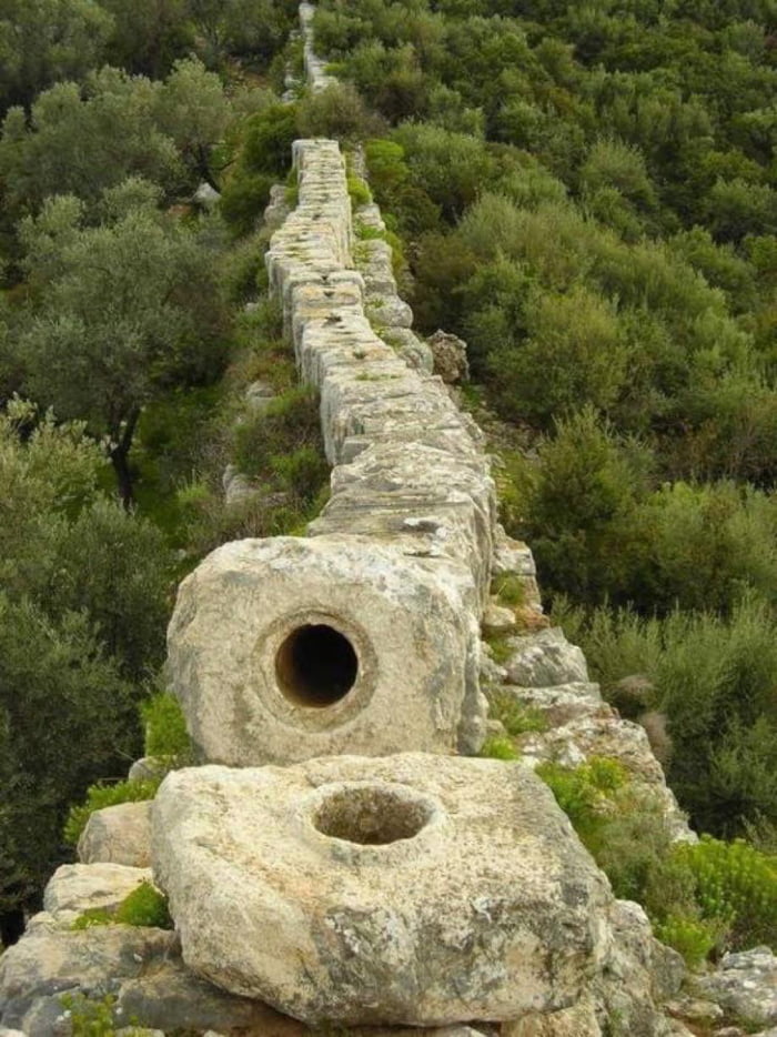 Portion of a Roman Aqueduct made out of hand-carved marble. The pieces ...