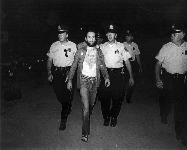 George Carlin Being Arrested For Violating The Obscenity Laws In george-carlin-being-arrested-for-violating-the-obscenity-laws-in