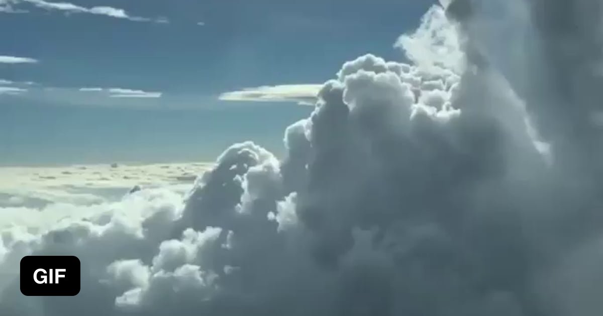 Flying through a gap in the clouds - 9GAG