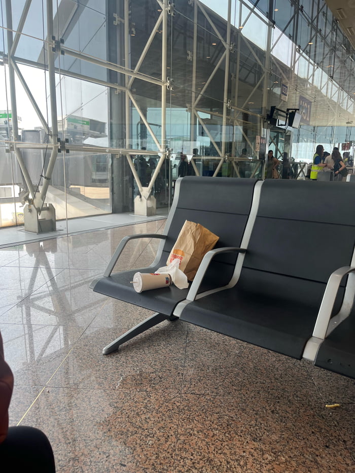 Trash at airport gate seats - 9GAG