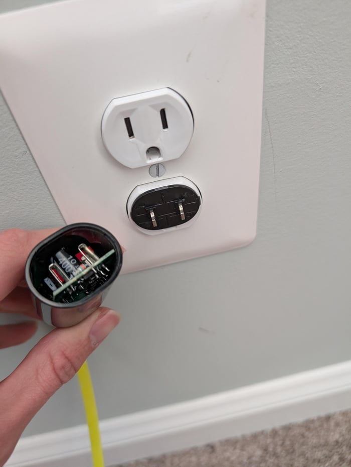 The way this USB charger broke off in the wall. - 9GAG