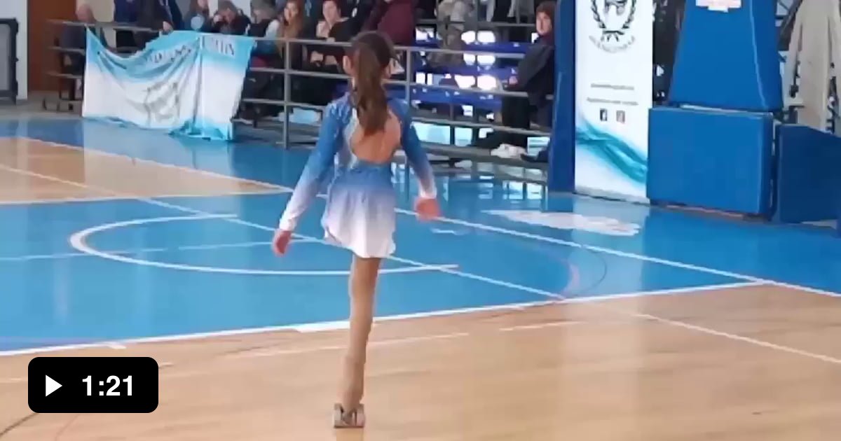Young artistic roller skater competing for the first time in school ...