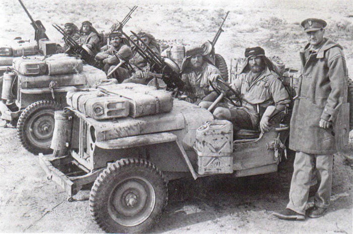 A British heavily armed patrol of L Detachment SAS in their jeeps, just ...