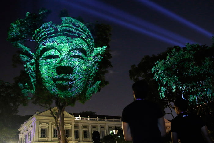 Projection mapping faces on to trees and having them talk to people ...