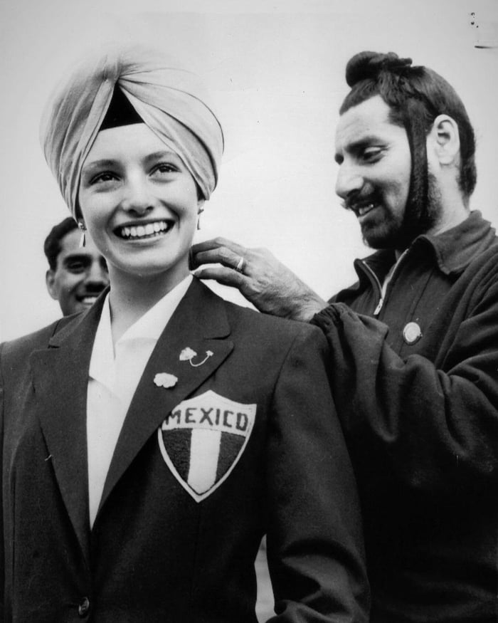 Indian field-hockey coach Baldev Singh tying a turban on Mexican fencer ...