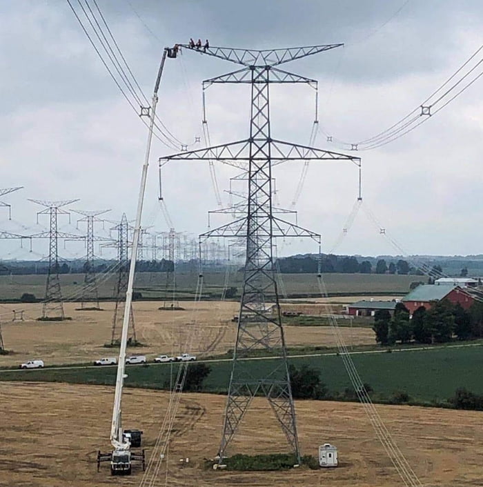 Linemans working on a pylon - 9GAG