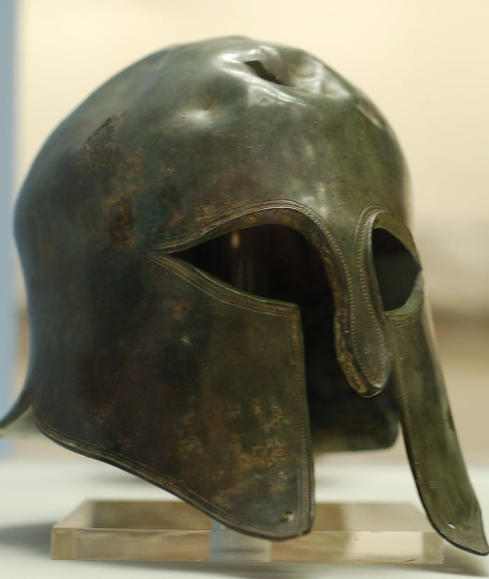 A damaged Spartan helmet, on display in the British Museum. This bronze ...