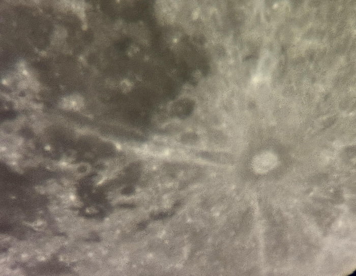 A detailed look at the lunar surface, revealing the intricate patterns ...