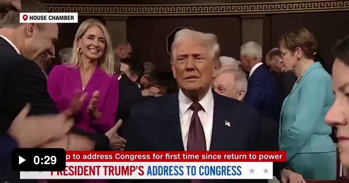 Rep. Melanie Stansbury held up a sign that said “this is not normal ...