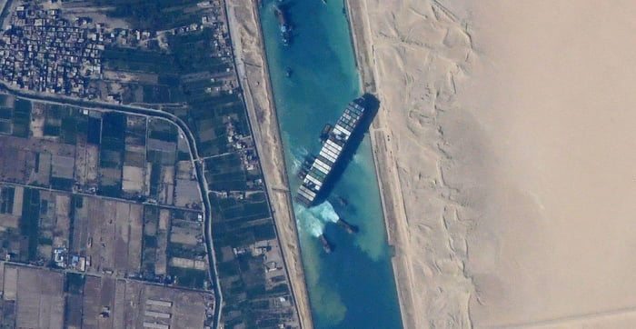 The Ever Given, wedged in the Suez Canal in 2021, as seen from the International Space Station ...