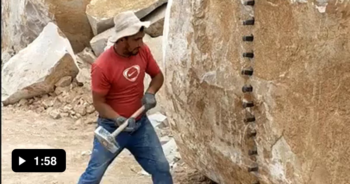 This guy patiently breaking this gigantic rock in half. - 9GAG