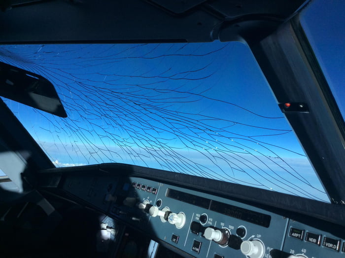 Mid flight cracked windshield on a plane - 9GAG
