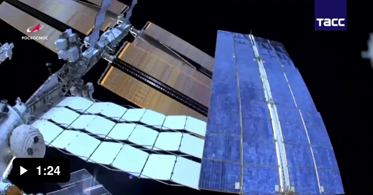 Russian cosmonauts perform an EVA and install a red flag with writing ...