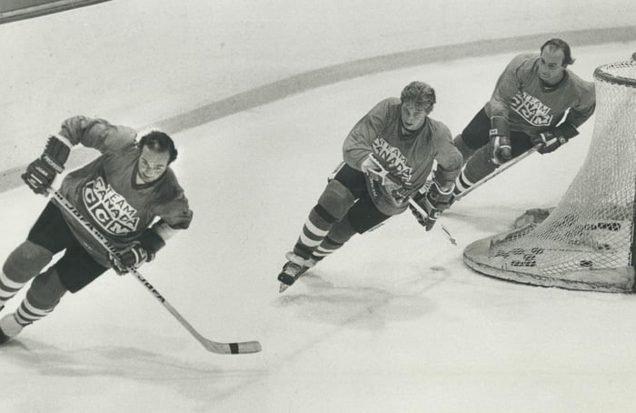 Steve Shutt, Wayne Gretzky and Guy Lafleur round the net in practice ...