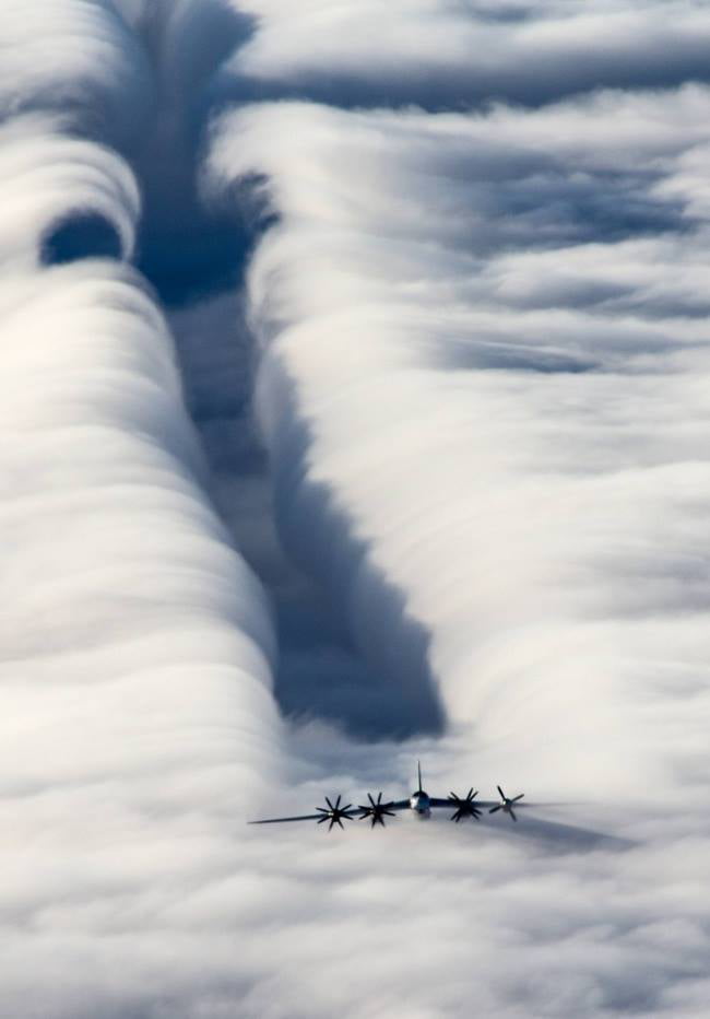 Tu95 parting the clouds apart. - 9GAG