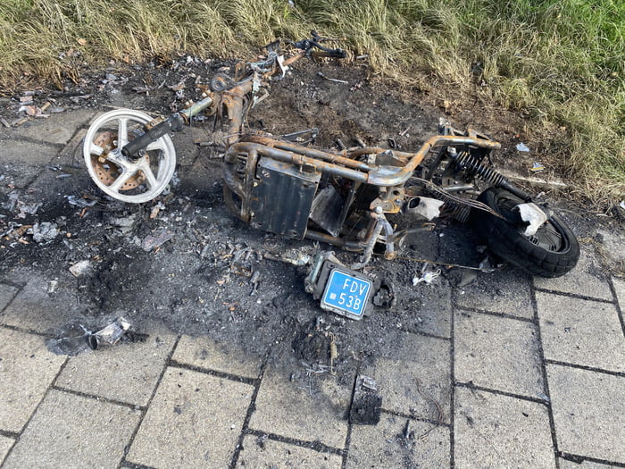 The burnt remains of a shared electric moped which you can hire through ...