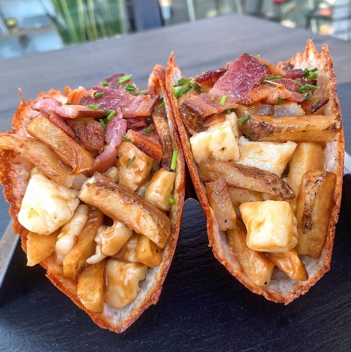 Poutine Tacos with fried cheese taco shell, French fries, cheese curds ...