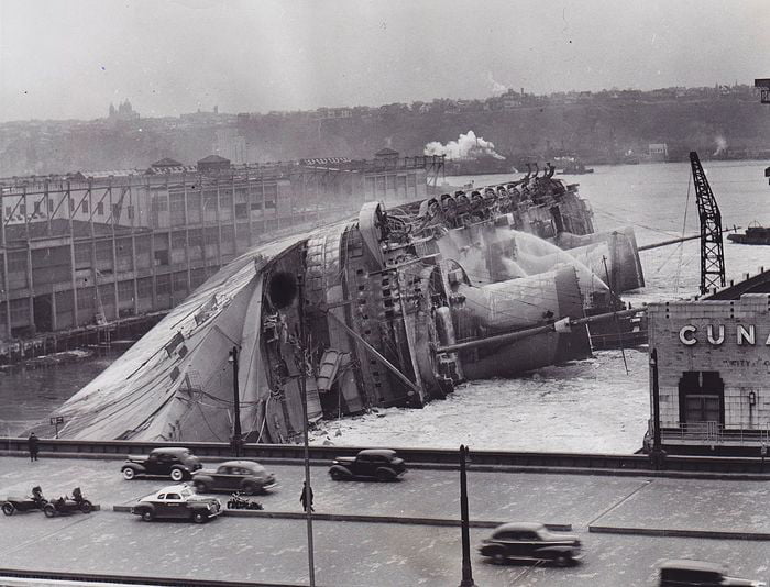 SS Normandie capsized and still burning in the Hudson River, New York ...