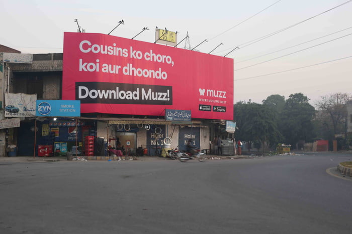 Muzz (Muslim Dating App) in Pakistan. Hoarding reads "Try something ...