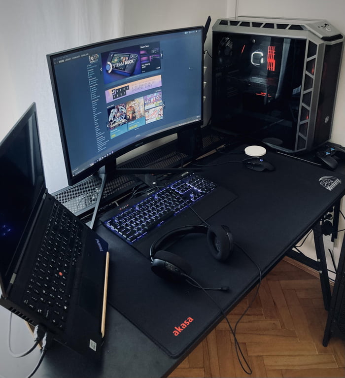 Setup for work and gaming. Small button above keyboard switches mouse and keyboard between ...