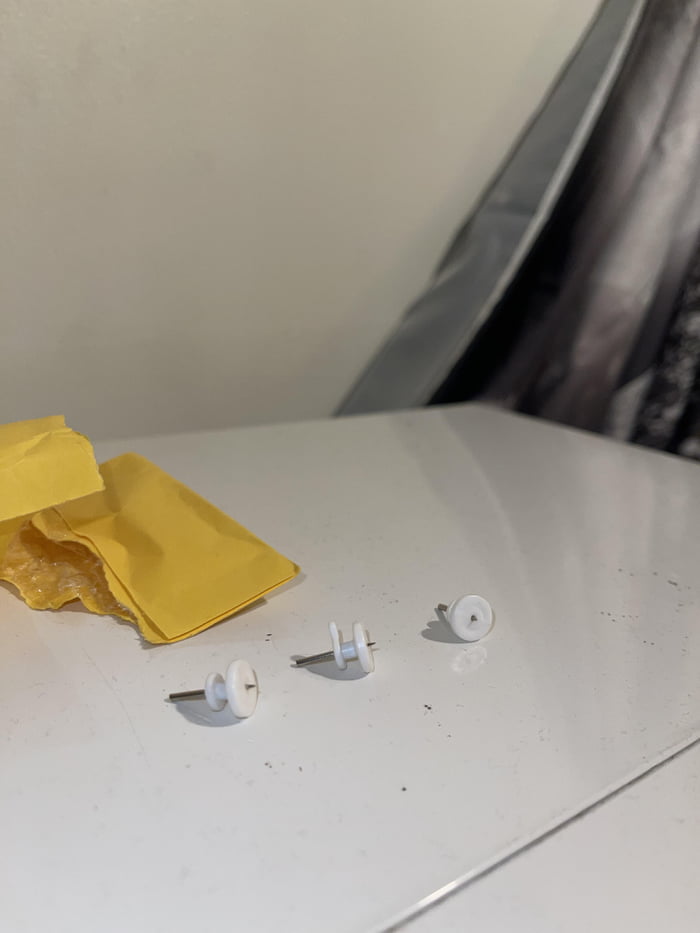 Tac or pin with blade sharp pin sticking out where you press in wall to ...